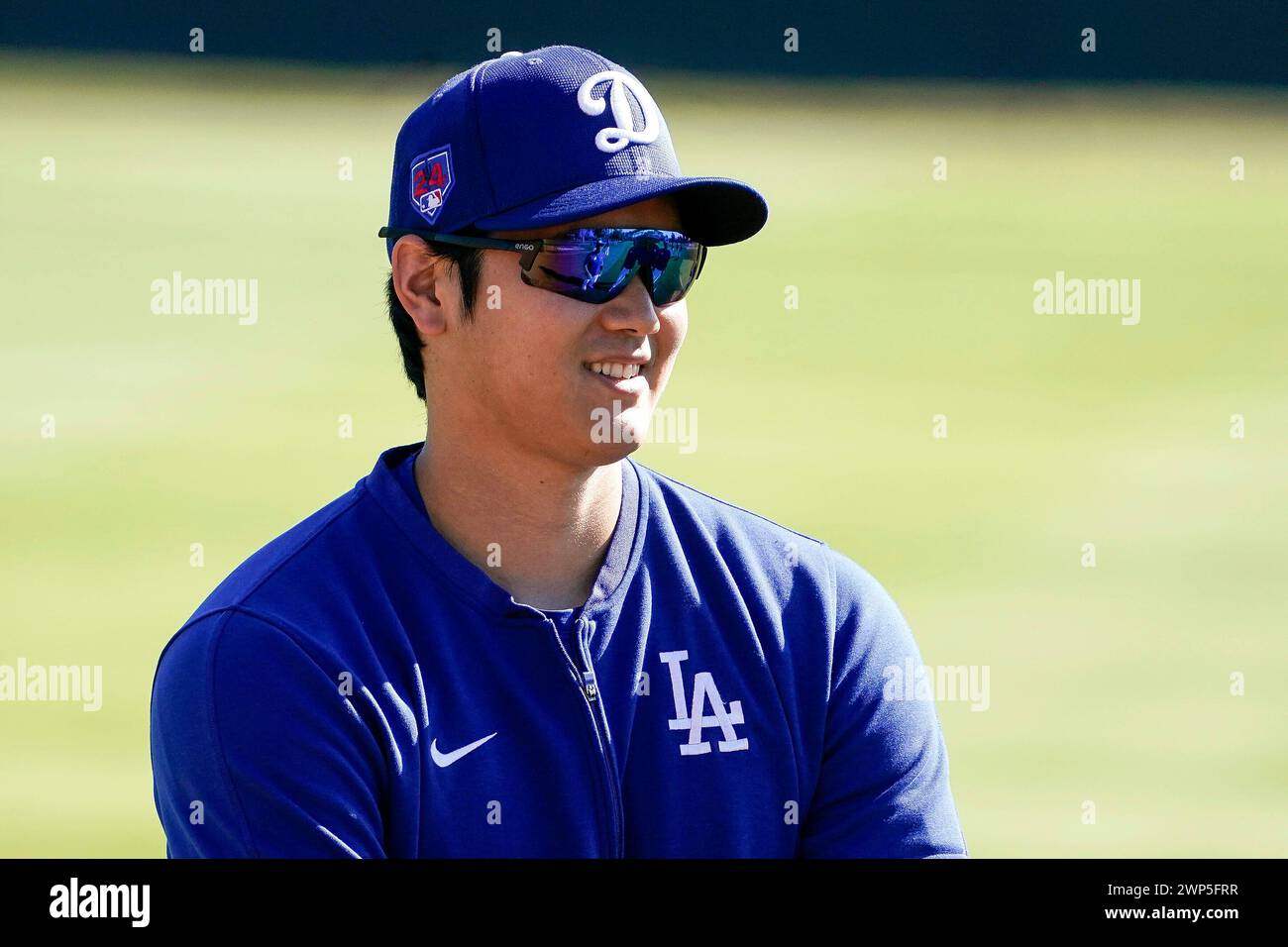 Los Angeles Dodgers' Shohei Ohtani smiles during baseball spring ...