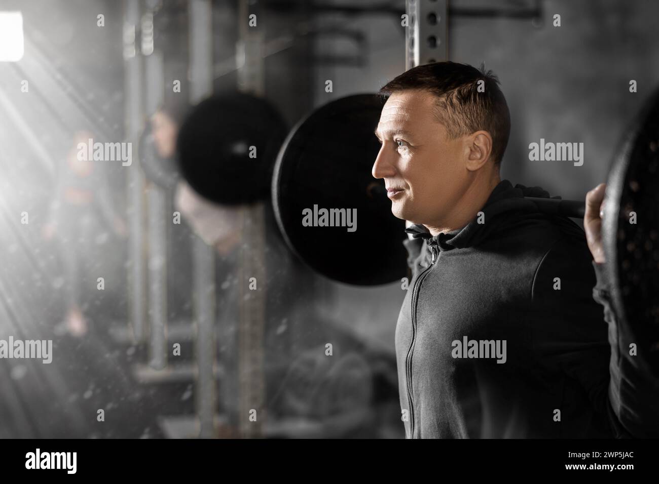 Athlete middle aged man during exercises to strengthen muscles of back ...