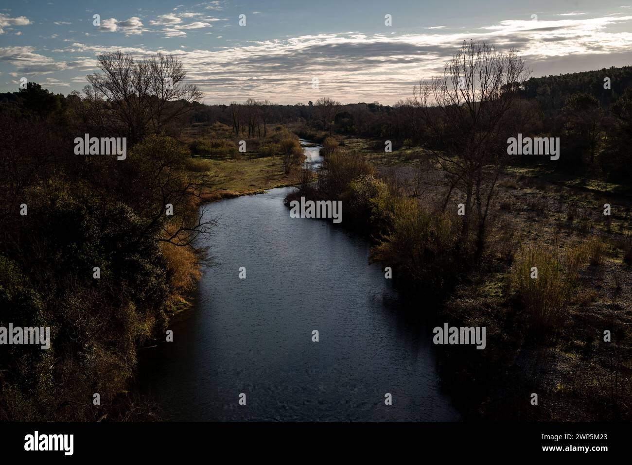 The Fluvia river as it passes by Sant Miquel de Fluvia, in north ...