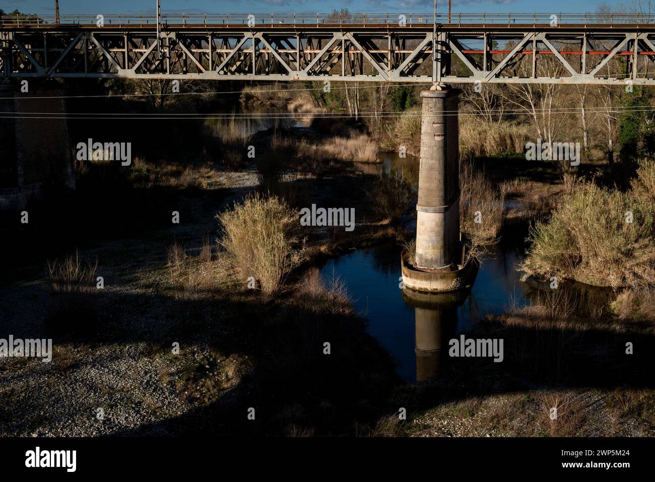 The Fluvia river as it passes by Sant Miquel de Fluvia, in north ...