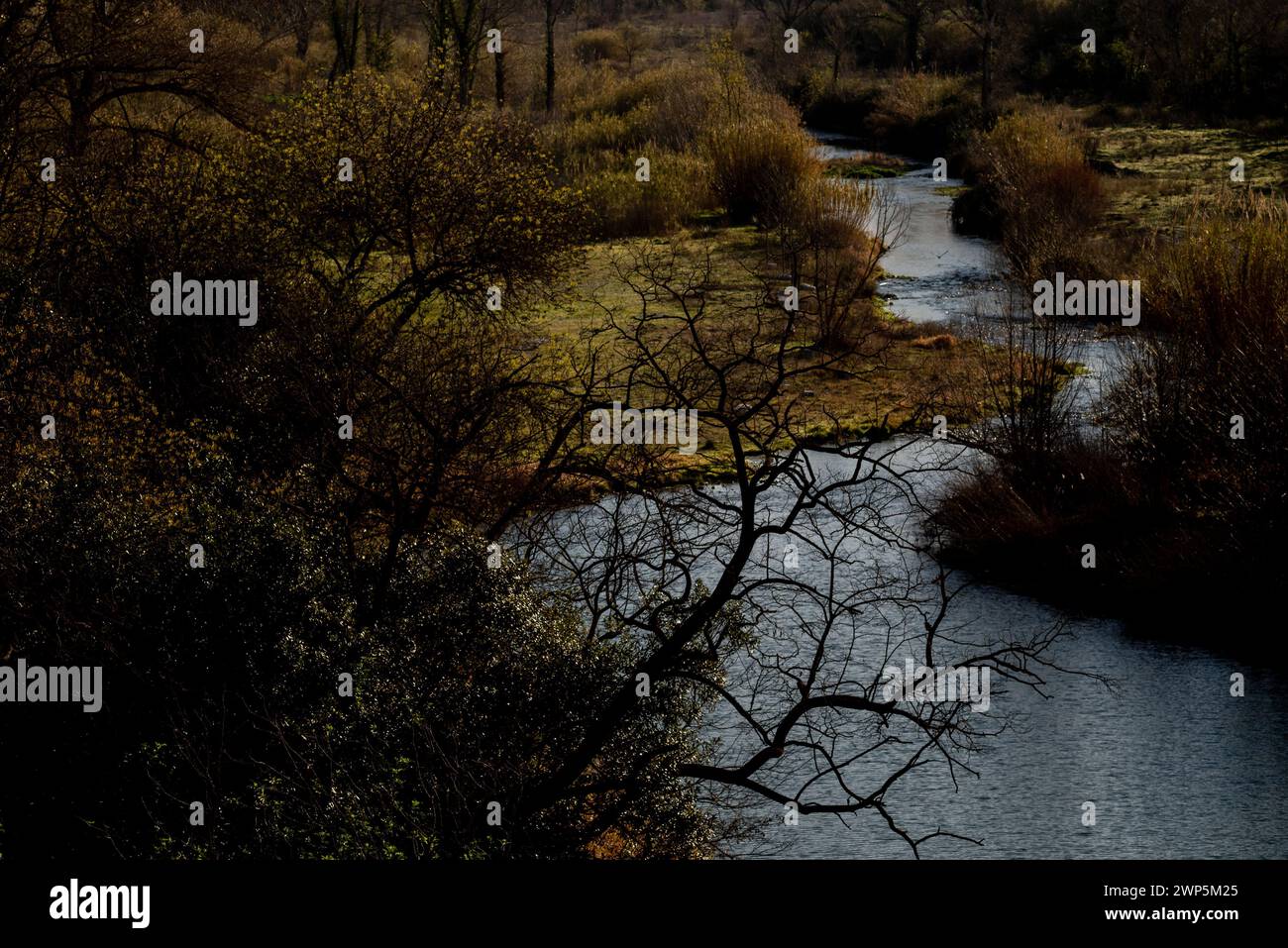 The Fluvia river as it passes by Sant Miquel de Fluvia, in north ...