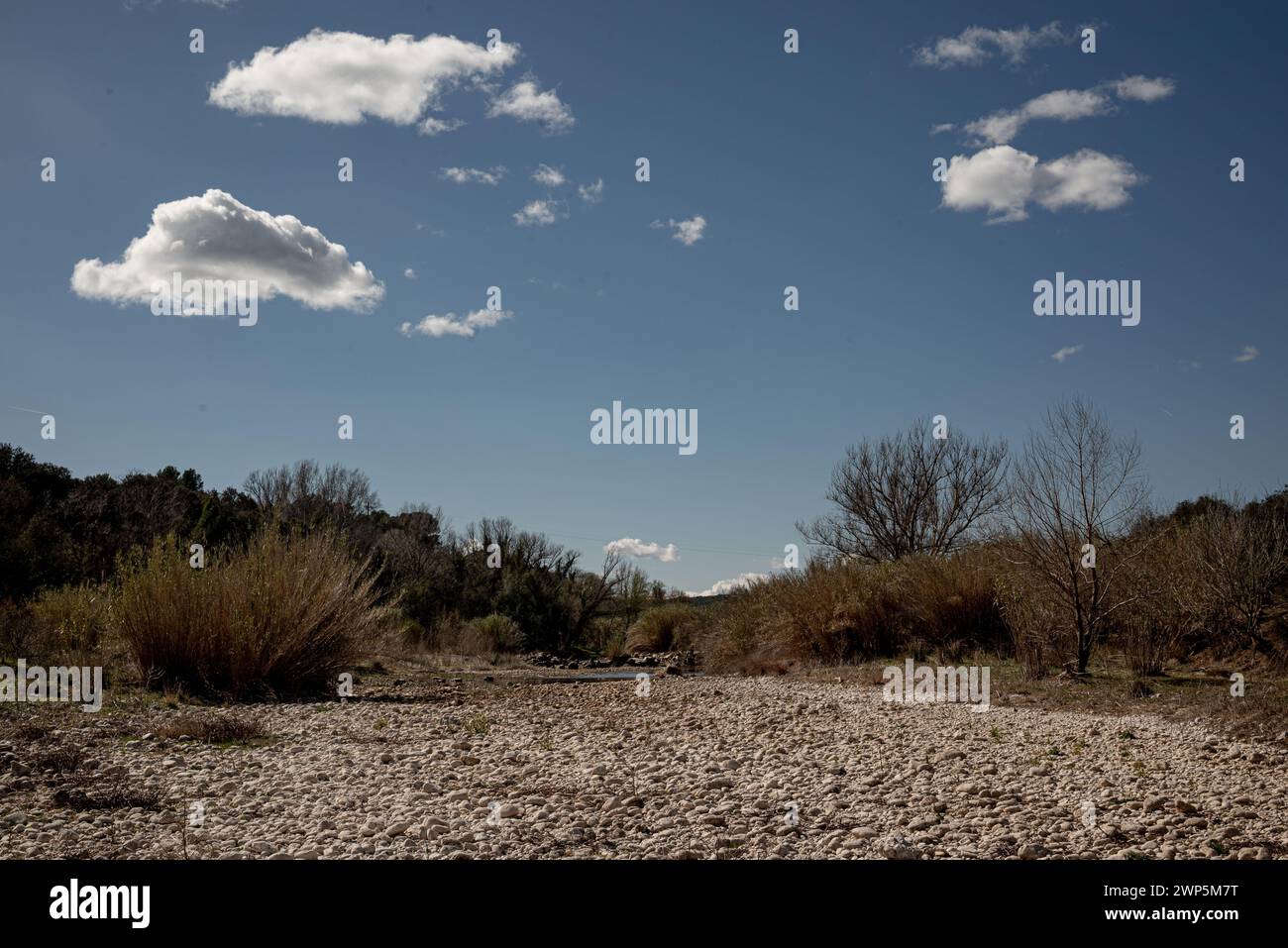 The dry riverbed of the Fluvia river as it passes by Sant Miquel de ...