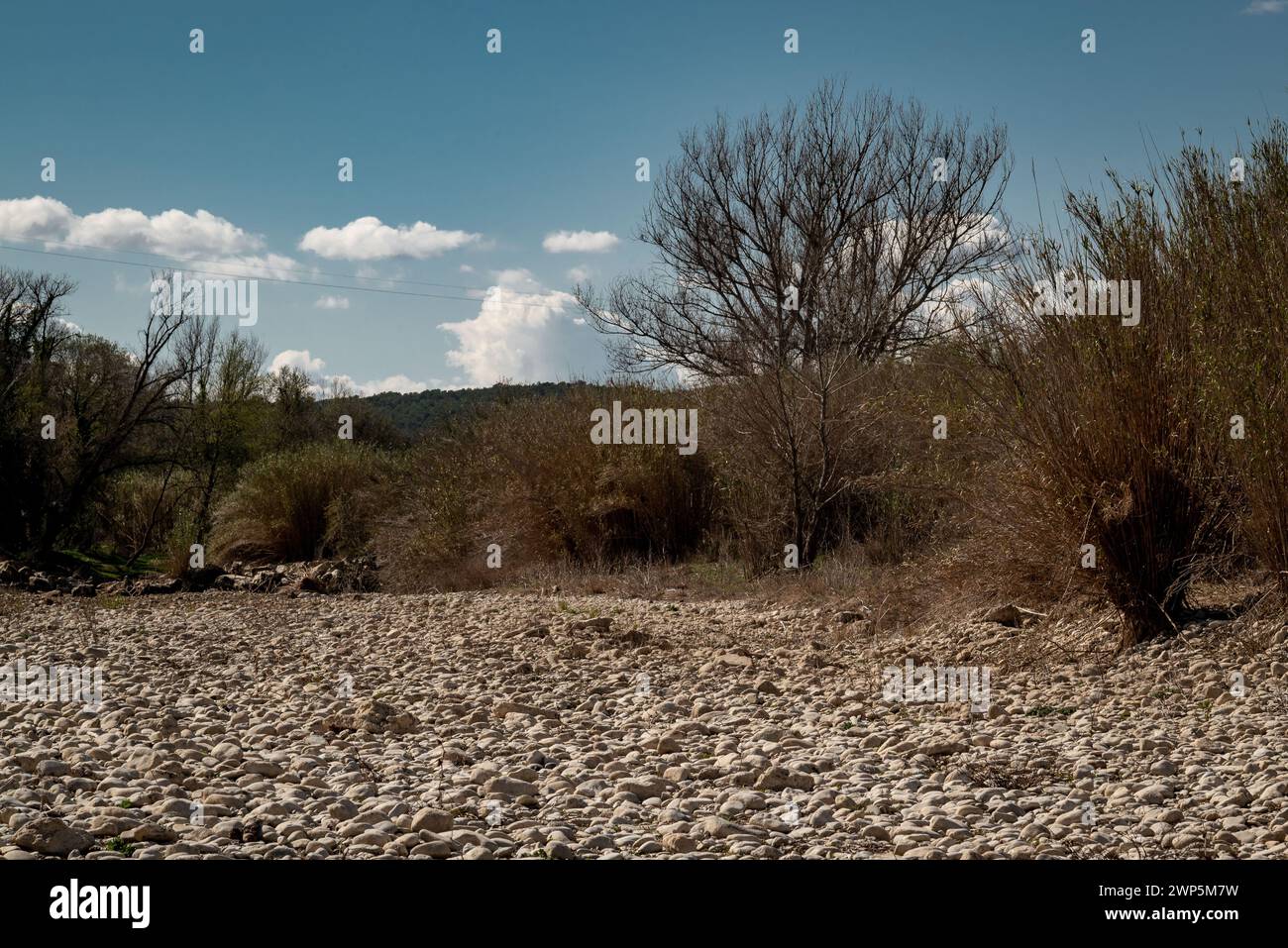 The dry riverbed of the Fluvia river as it passes by Sant Miquel de ...