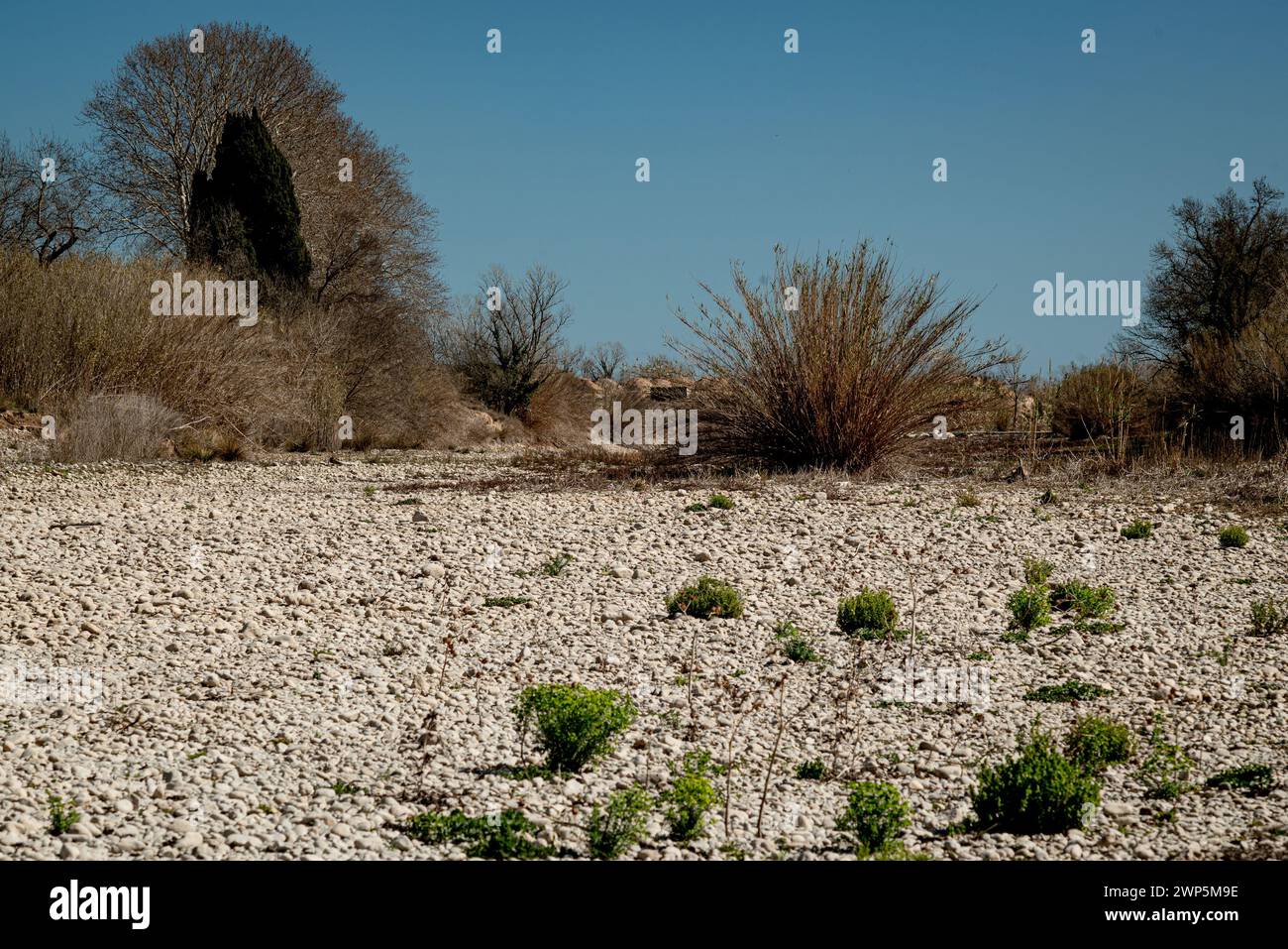 The dry riverbed of the Fluvia river as it passes by Sant Miquel de ...