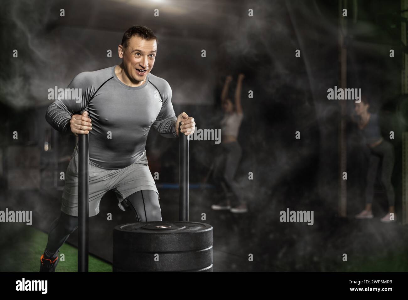 Man during grueling workout with element of push and pull superset in ...