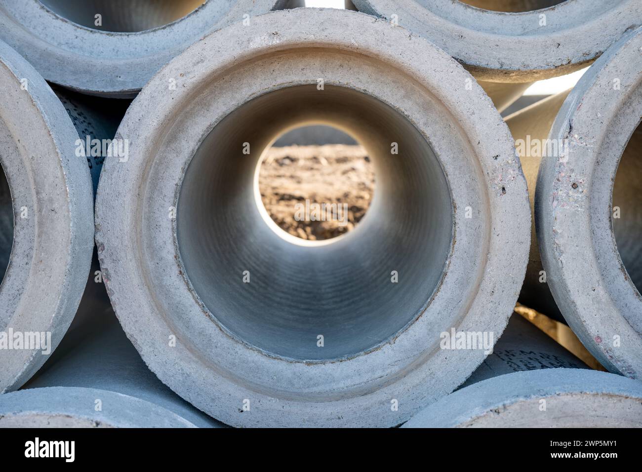 Concrete pipes with center hole resemble automotive tires Stock Photo ...