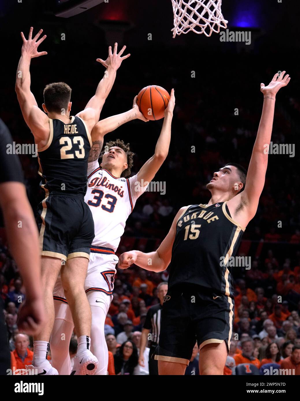 Illinois' Coleman Hawkins (33) shoots as Purdue's Camden Heide (23) and ...