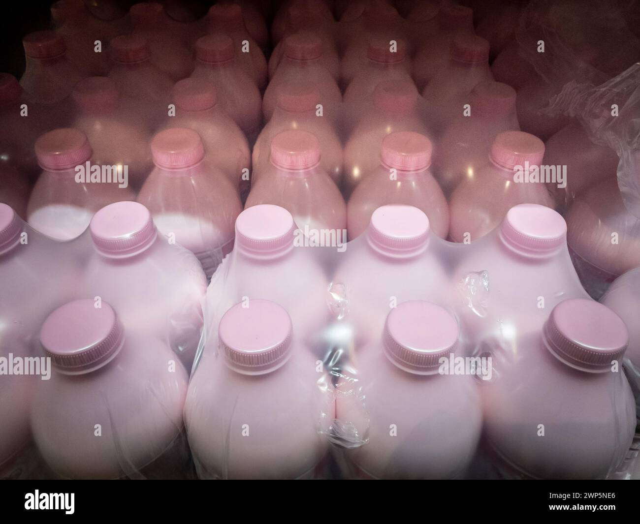 Picture of a pellet of pink yogurt bottles ready to be shipped from a ...
