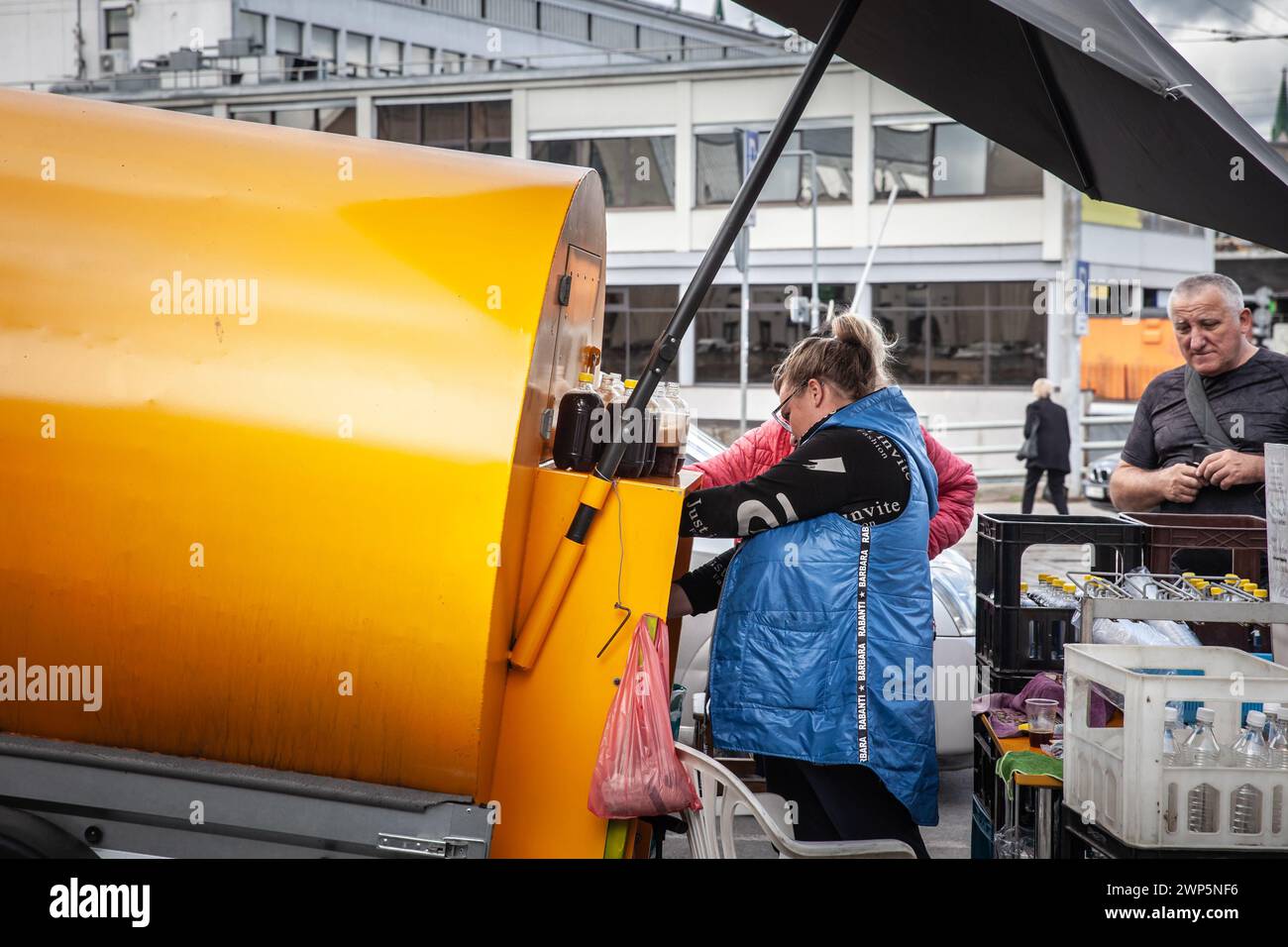 Picture of a female selling kvas in a street of Riga, Latvia. Kvass is ...