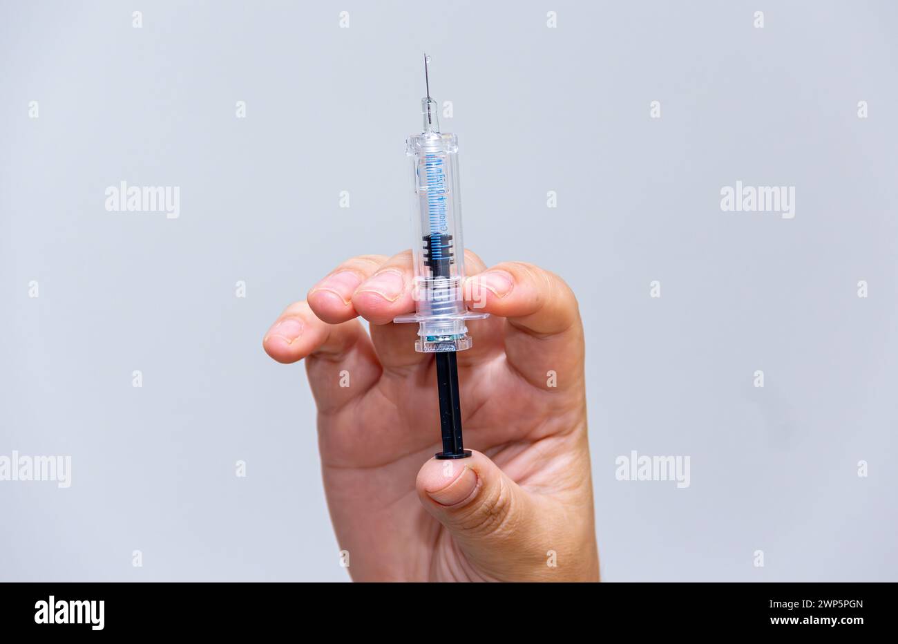 Syringe, medical injection in hand, medicinal plastic vaccination ...