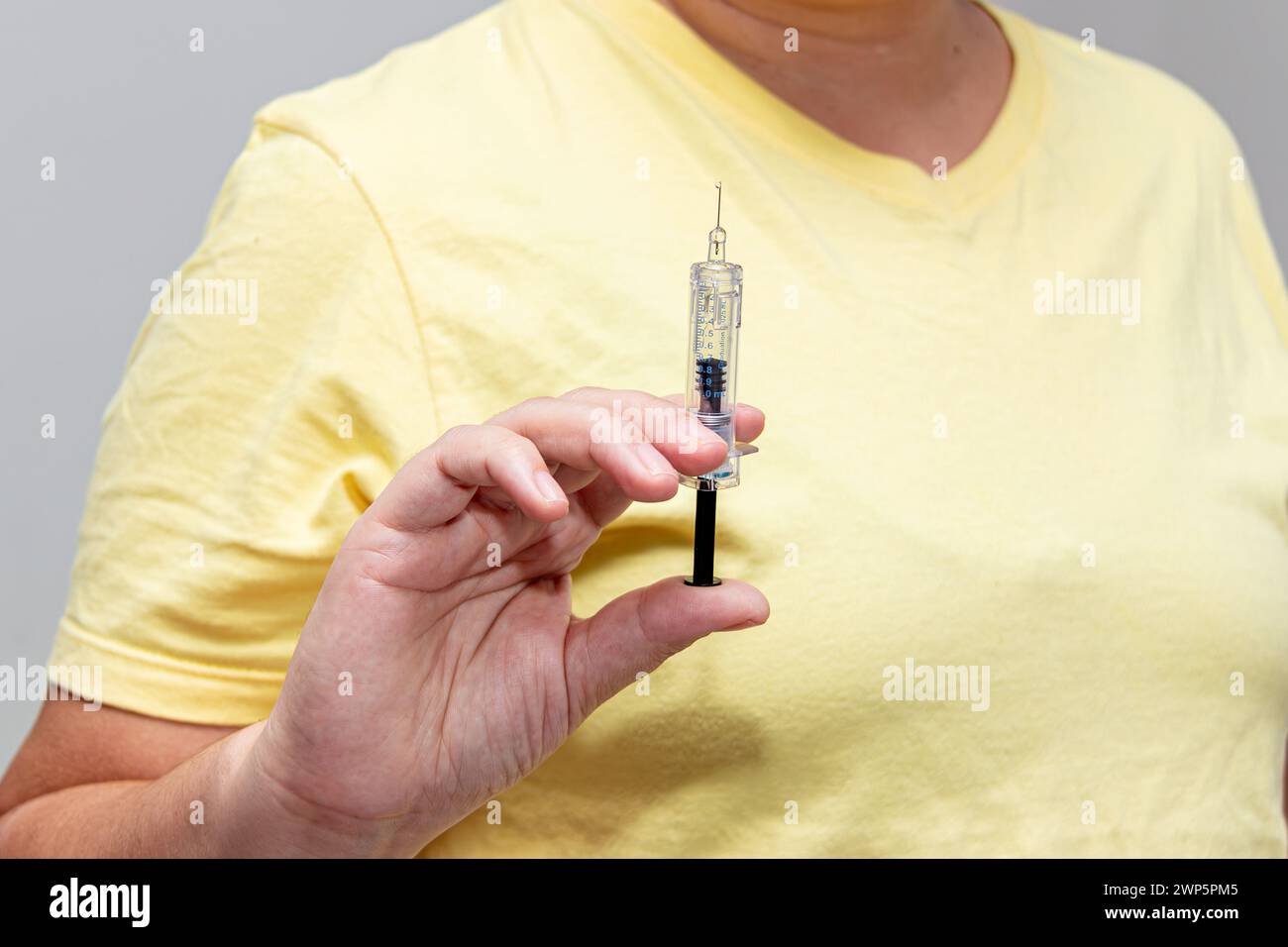 Syringe, medical injection in hand, medicinal plastic vaccination ...