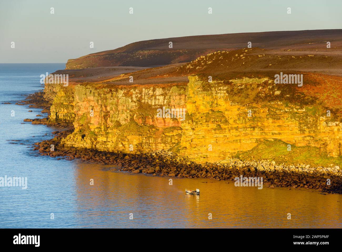 The fishing boat Yung Dhal WK190 below the cliffs on the western side ...