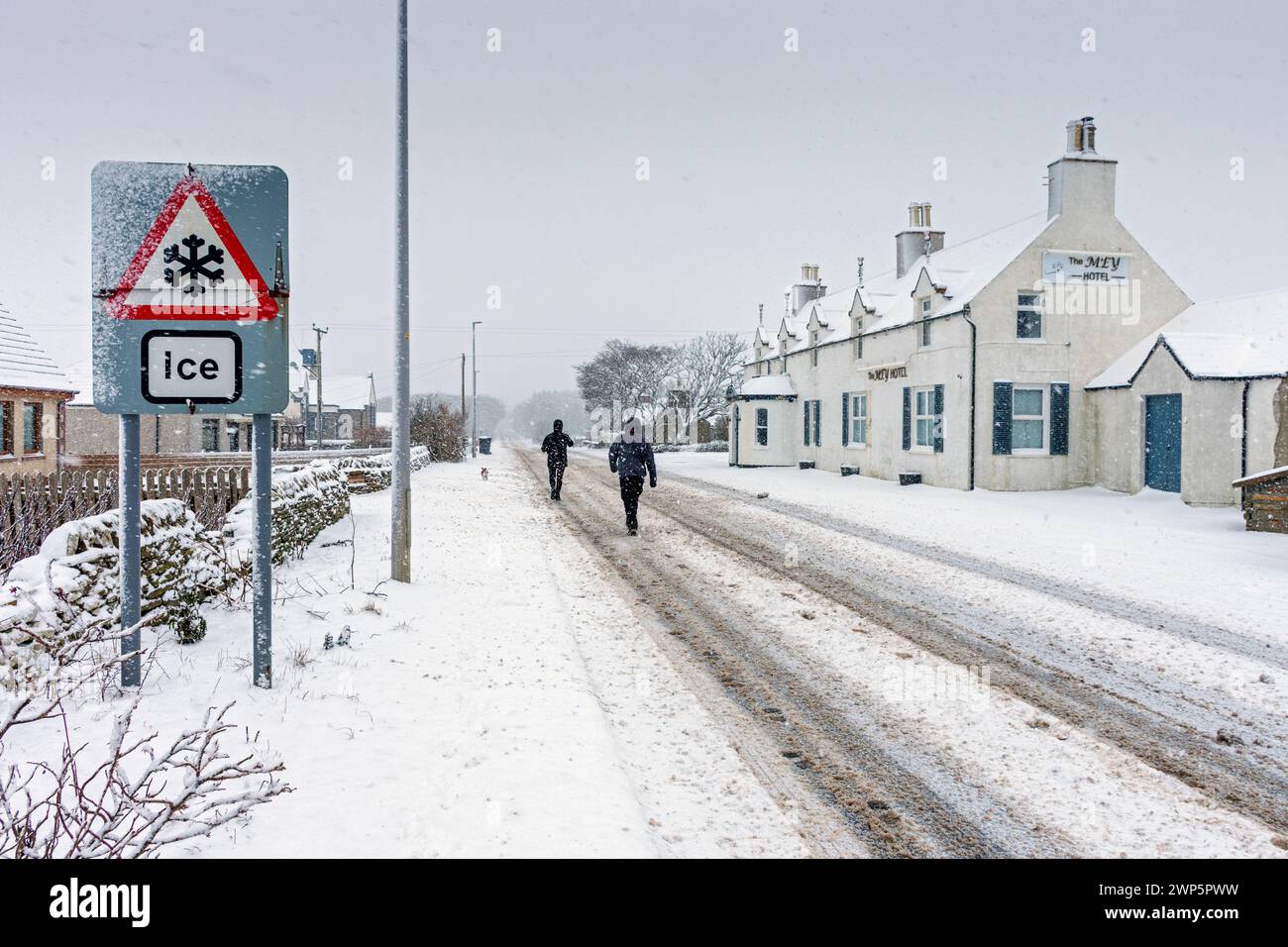 The Mey Hotel and an 'Ice' warning sign on the A836 trunk road in snowy ...