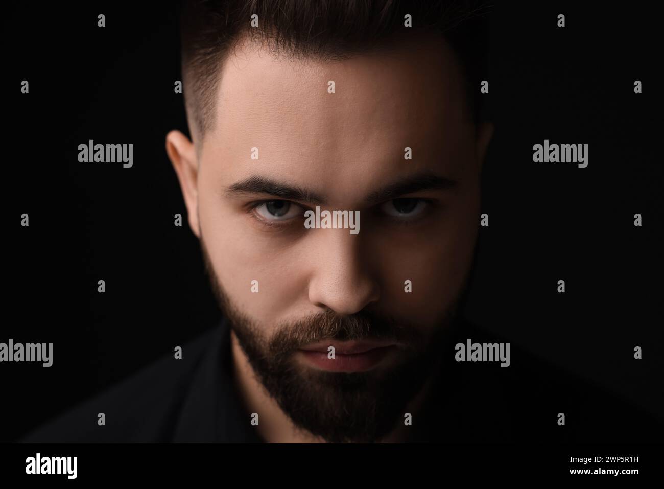 Evil eye. Man with scary eyes on black background Stock Photo - Alamy