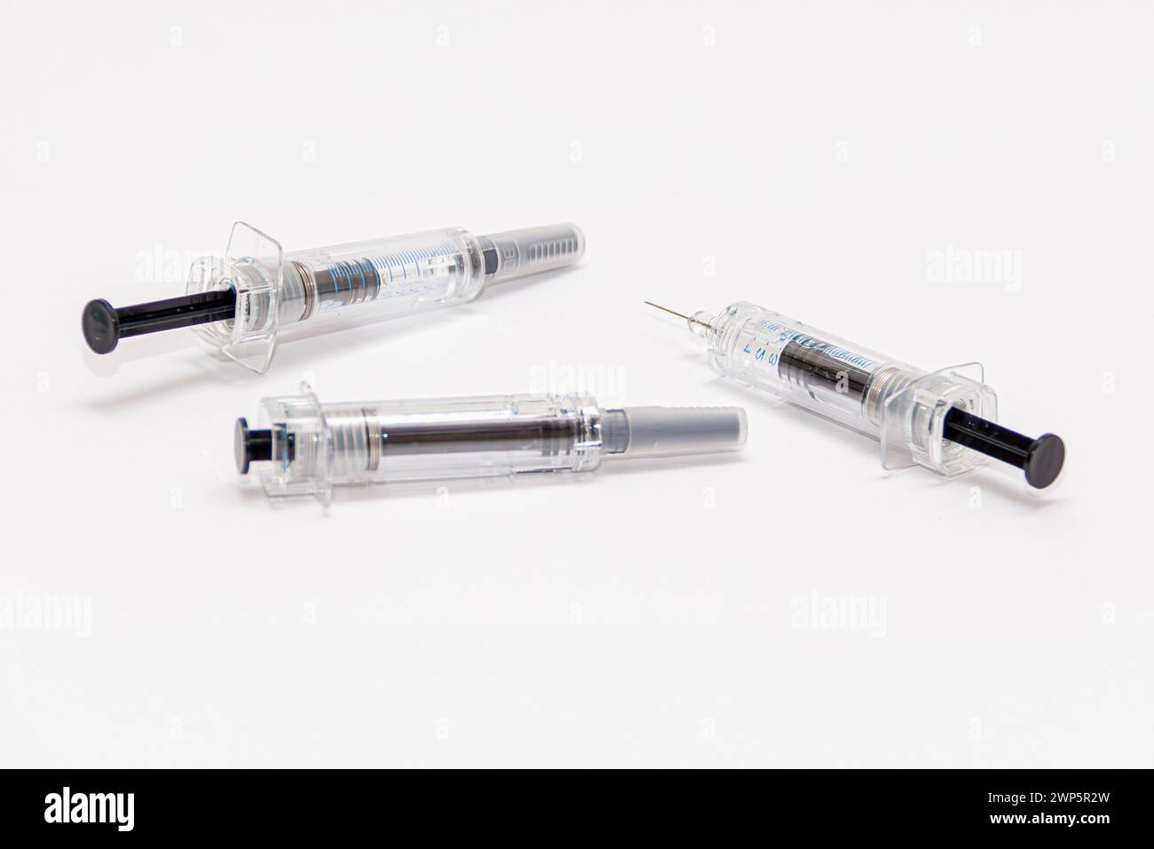 Injection syringes on a white background Stock Photo - Alamy