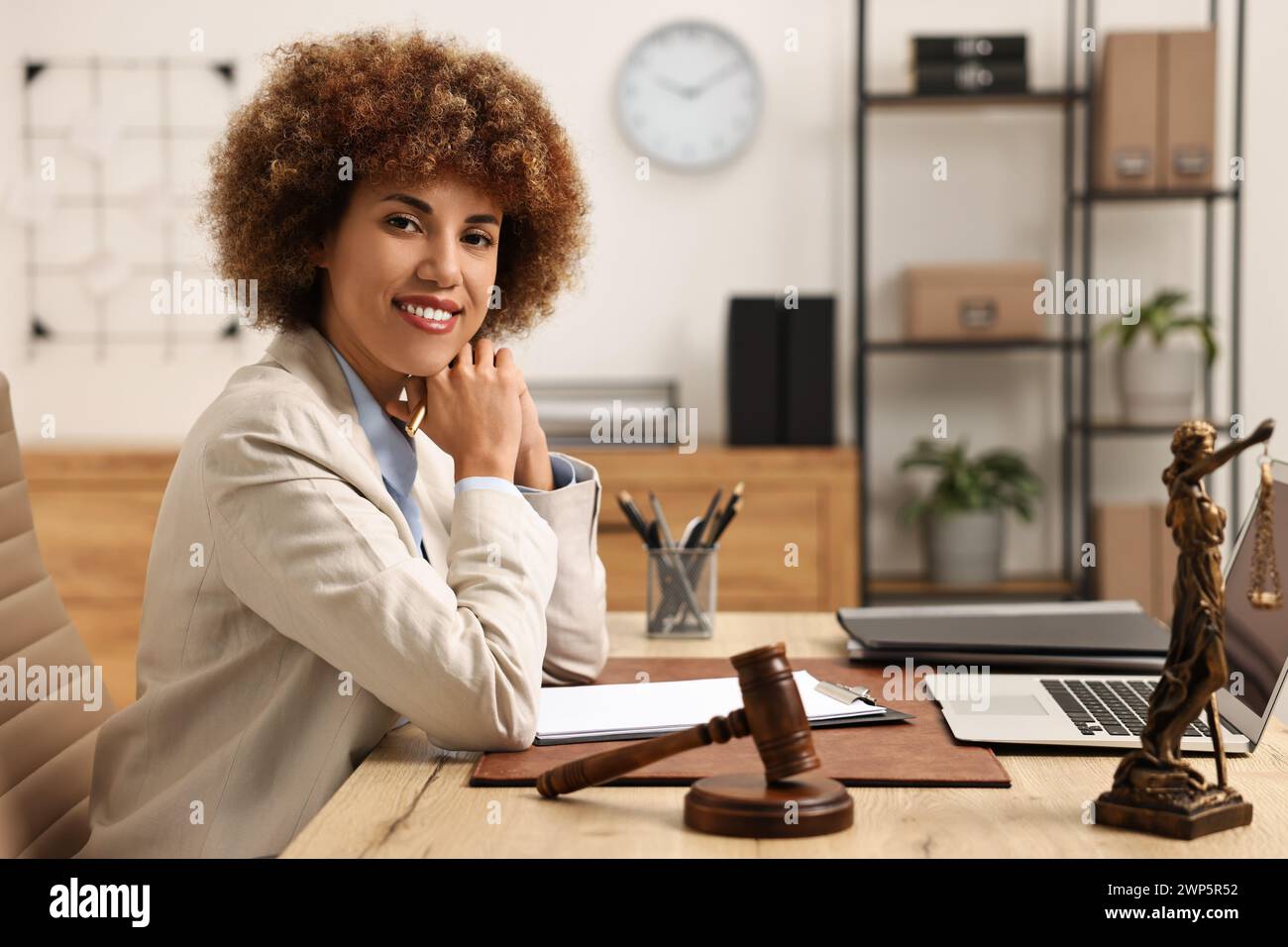 Beautiful female notary at workplace in office Stock Photo - Alamy