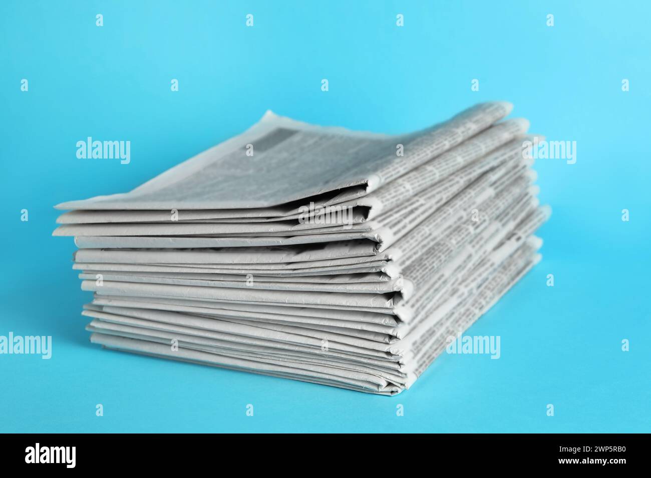 Pile of newspapers blue background hi-res stock photography and images ...