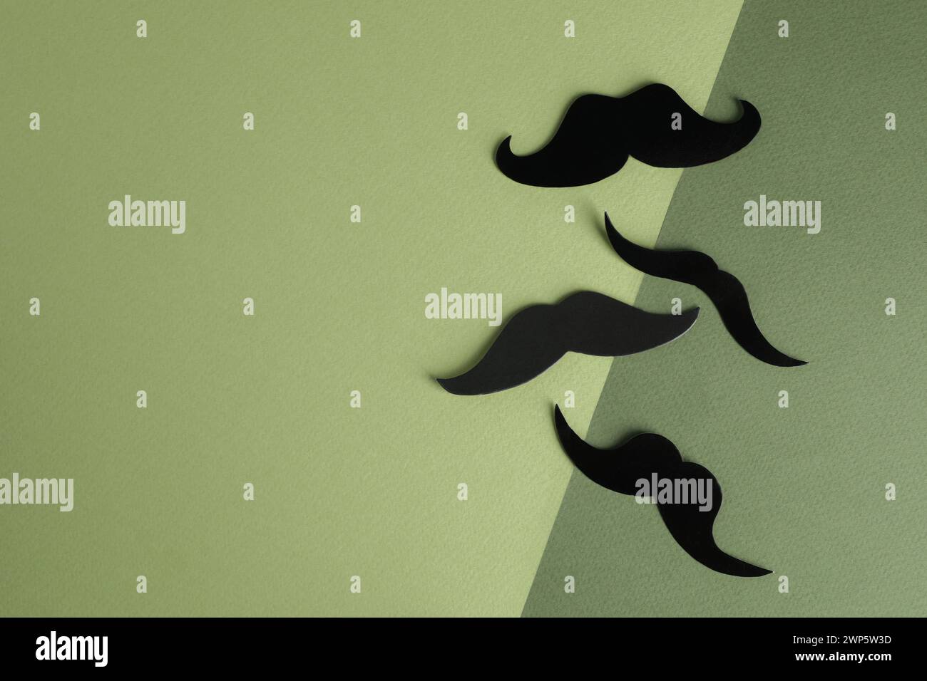 Fake paper mustaches on color background, flat lay. Space for text ...