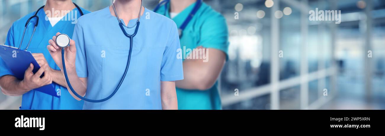 Doctors and nurse in hospital, closeup. Banner design with space for ...