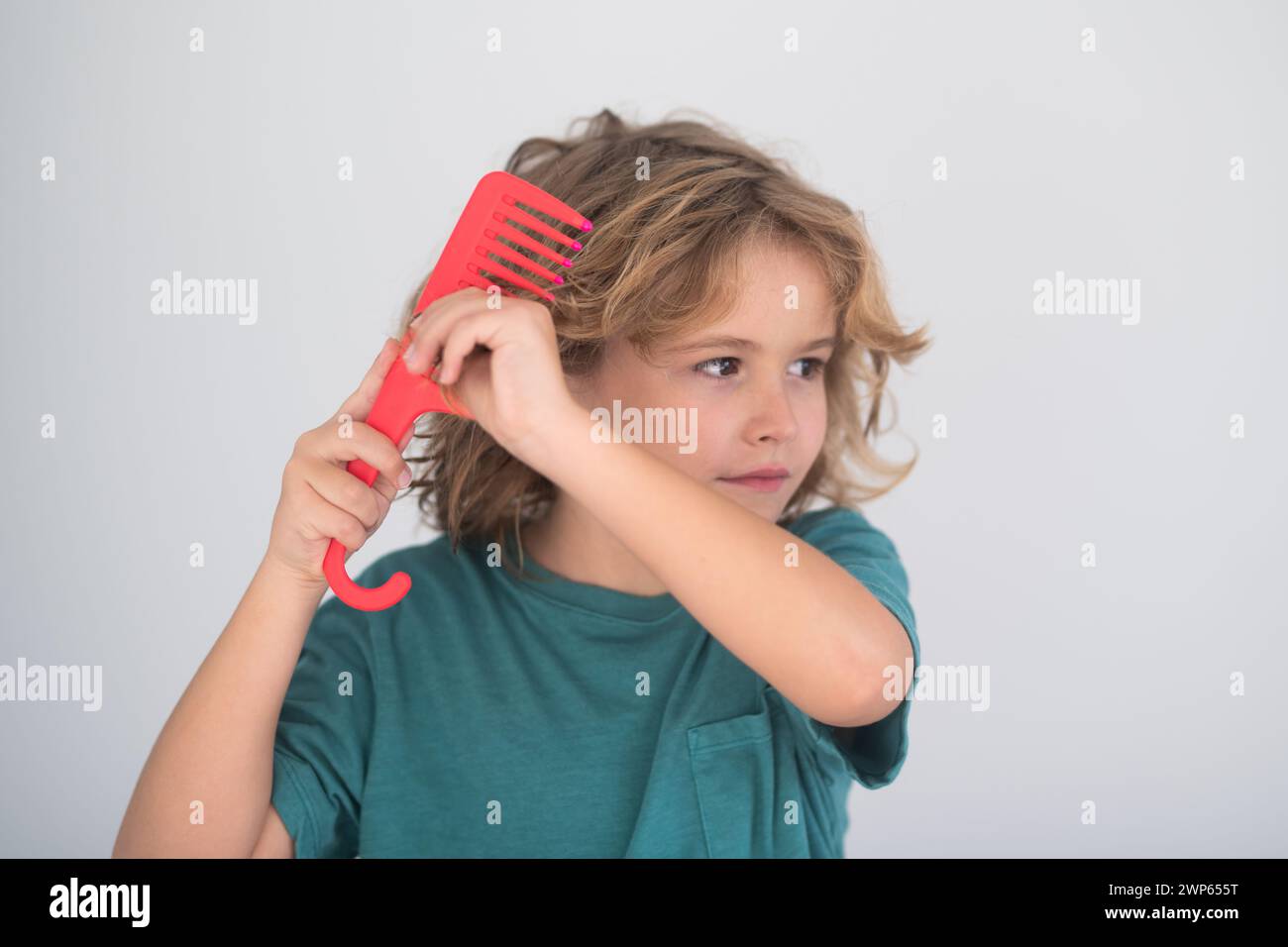 Comb and hair brush concept. Funny child hairstyle. Cute child with ...