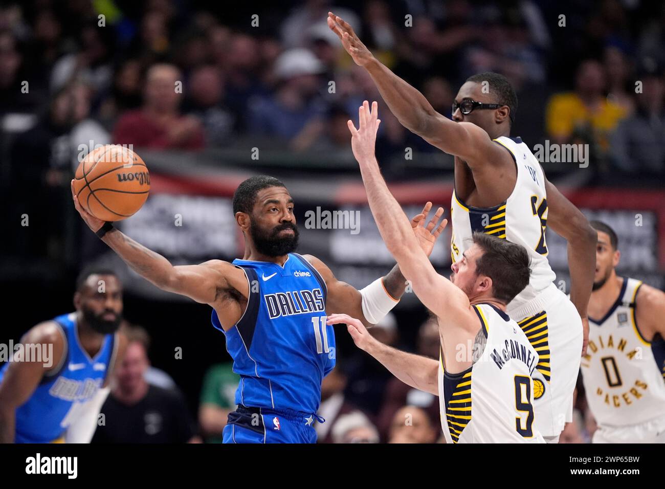 Dallas Mavericks guard Kyrie Irving (11) passes the ball as Indiana ...