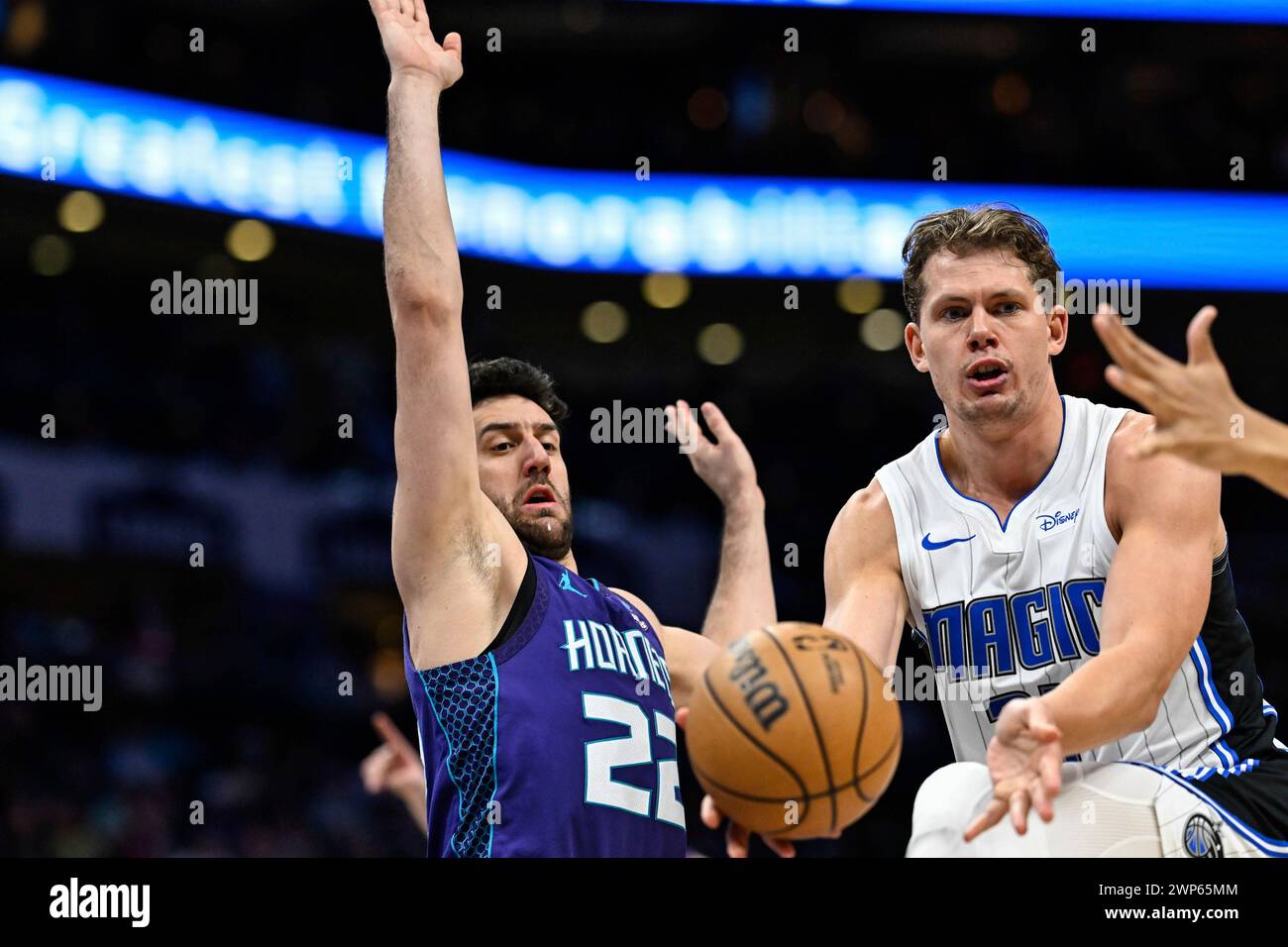 Orlando Magic center Moritz Wagner passes the ball away from Charlotte ...