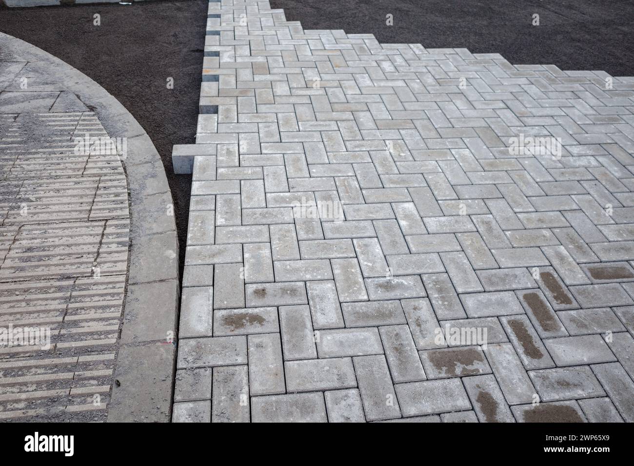 The diverse textures and patterns of urban street paving, featuring a ...
