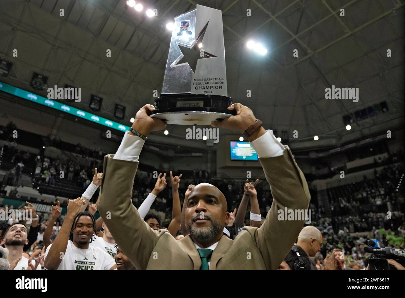 South Florida head coach Amir Abdur-Rahim holds up the American ...