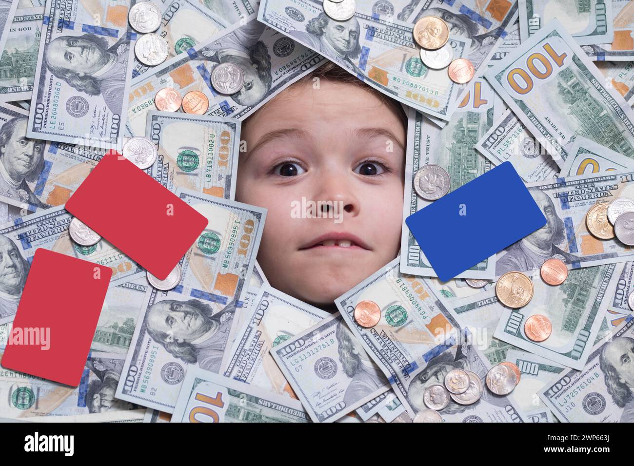 Kid with fun face in money. Cash dollars banknotes, coins and credit ...