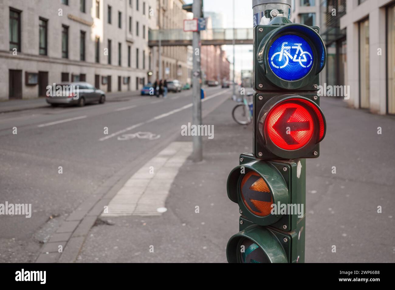 A close-up view of a traffic signal post at an urban intersection ...