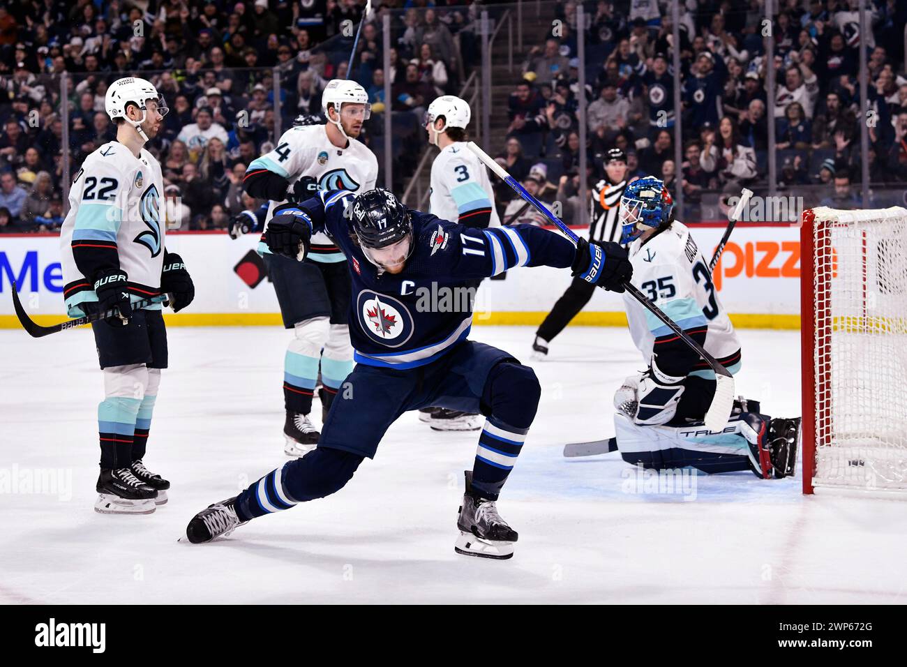 Winnipeg Jets' Adam Lowry (17) celebrates his goal on Seattle Kraken ...