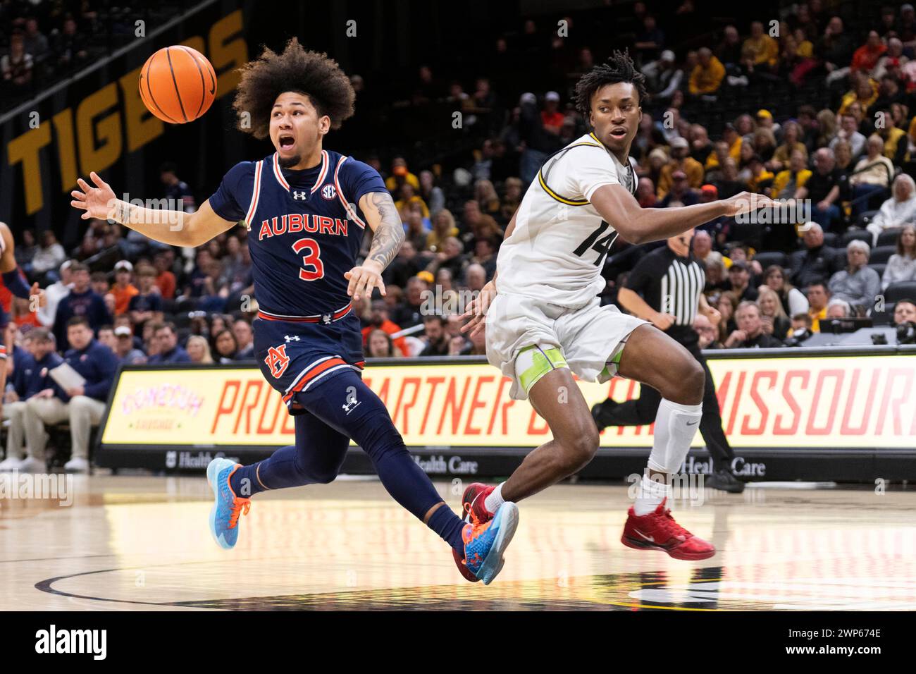 Auburn's Tre Donaldson, left, loses the ball in front of Missouri's ...