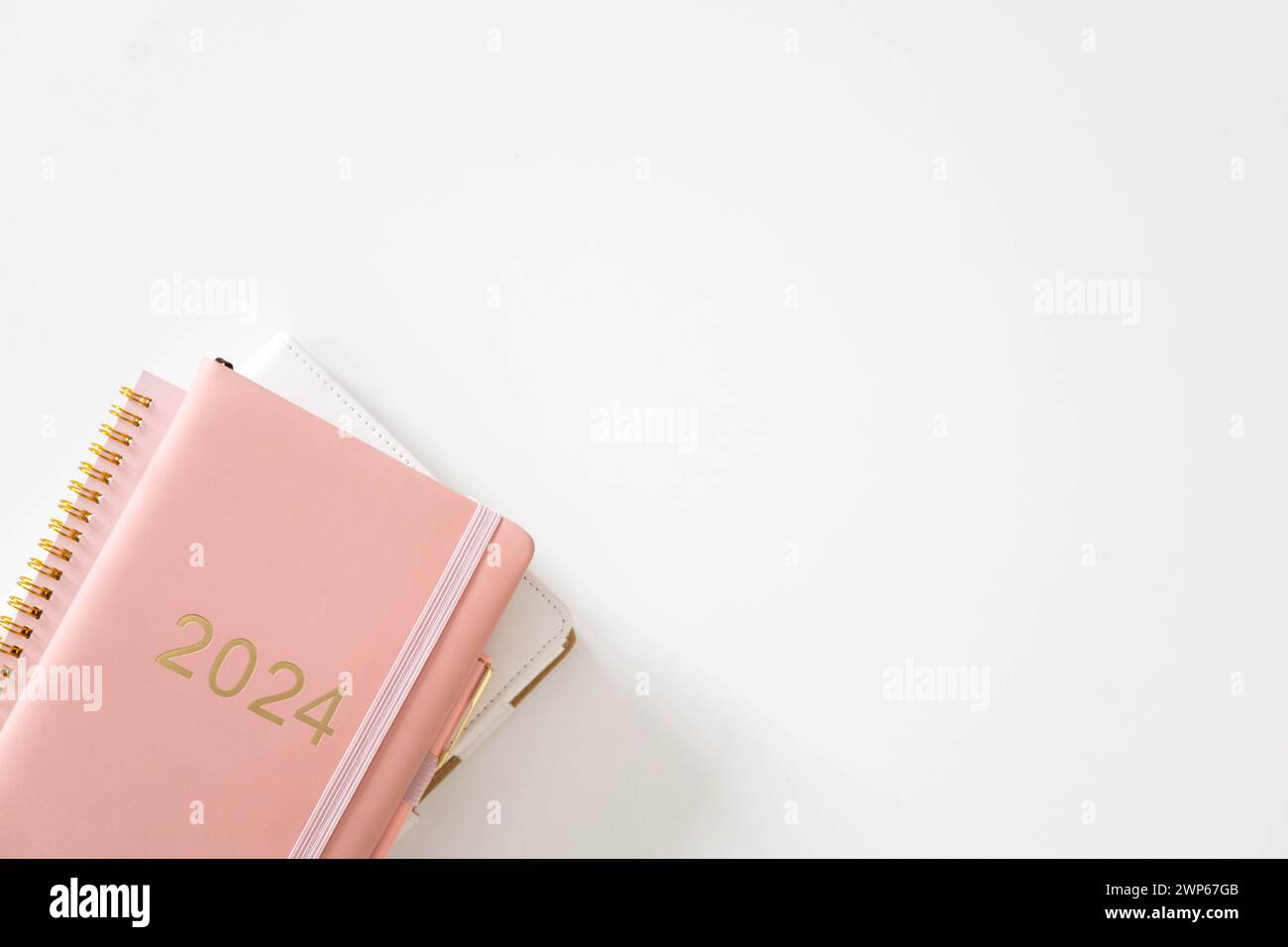 Pink coral colored diary for the year 2024 and many other diaries, pen ...