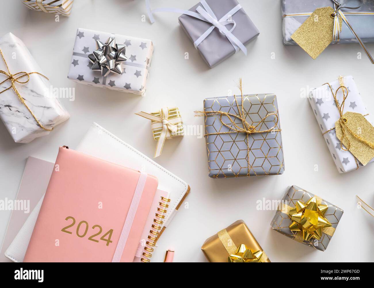 Pink coral colored diary for the year 2024 and New Year's gift boxes ...