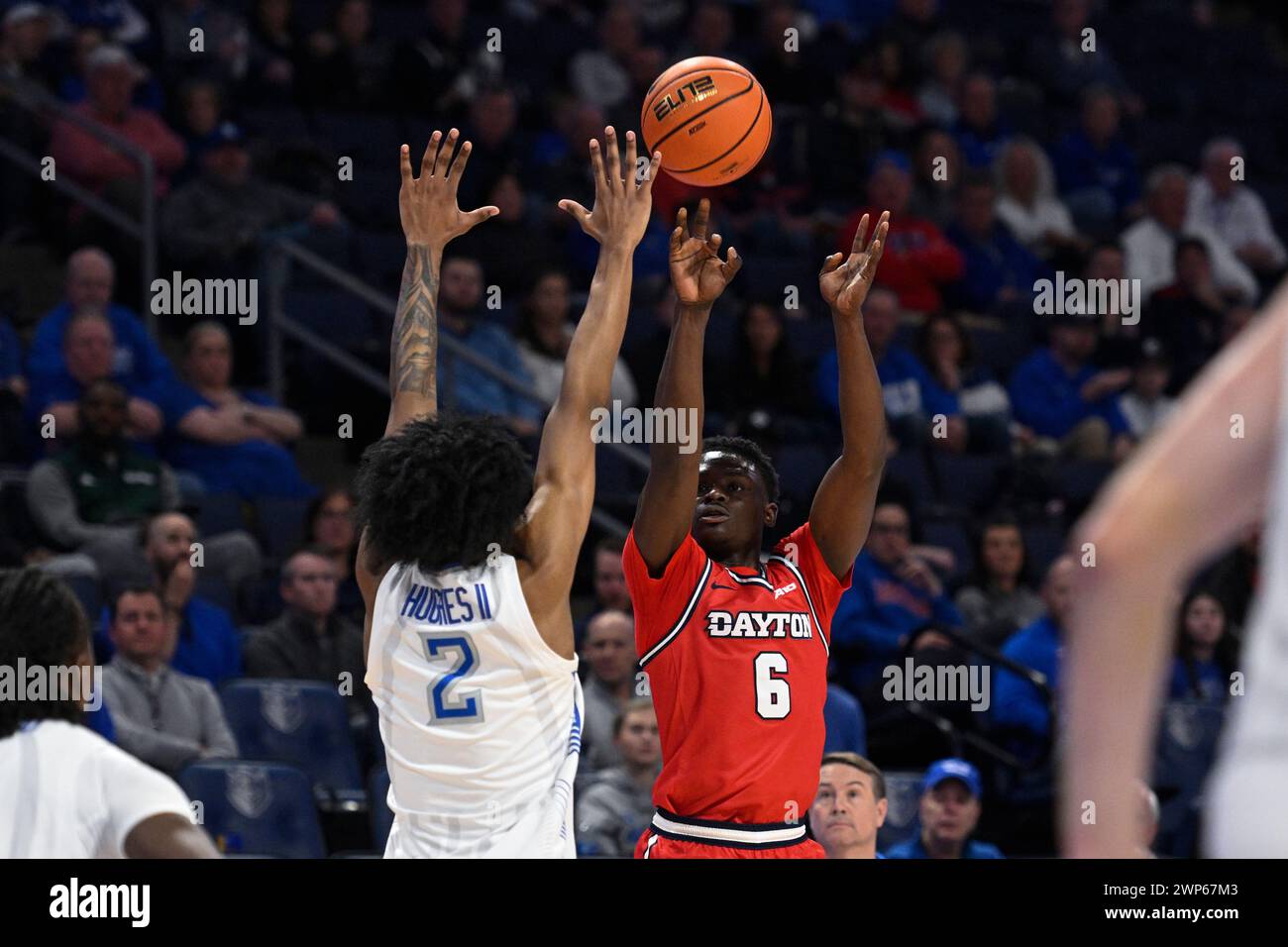 Dayton's Enoch Cheeks, right, goes up for a shot against Saint Louis ...