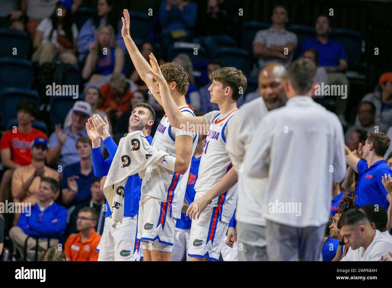 The Florida bench celebrates a point during the second half of an NCAA ...