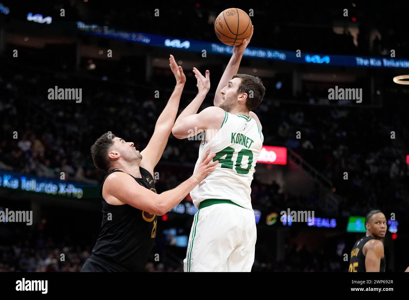 Boston Celtics center Luke Kornet (40) shoots over Cleveland Cavaliers forward Georges Niang ...