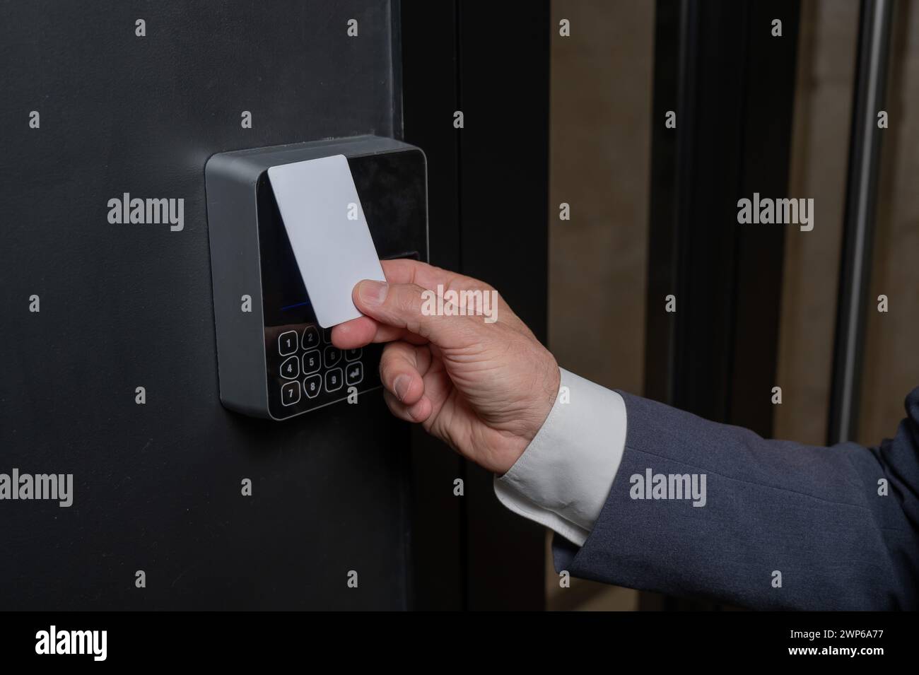 A man opens the door with a card. Modern electronic lock. Keyless Entry ...