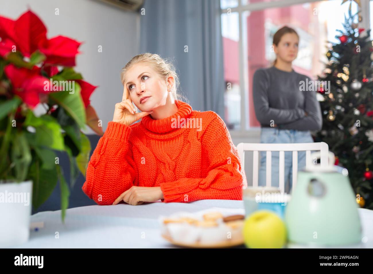 Upset adult woman ignoring her daughter Stock Photo - Alamy