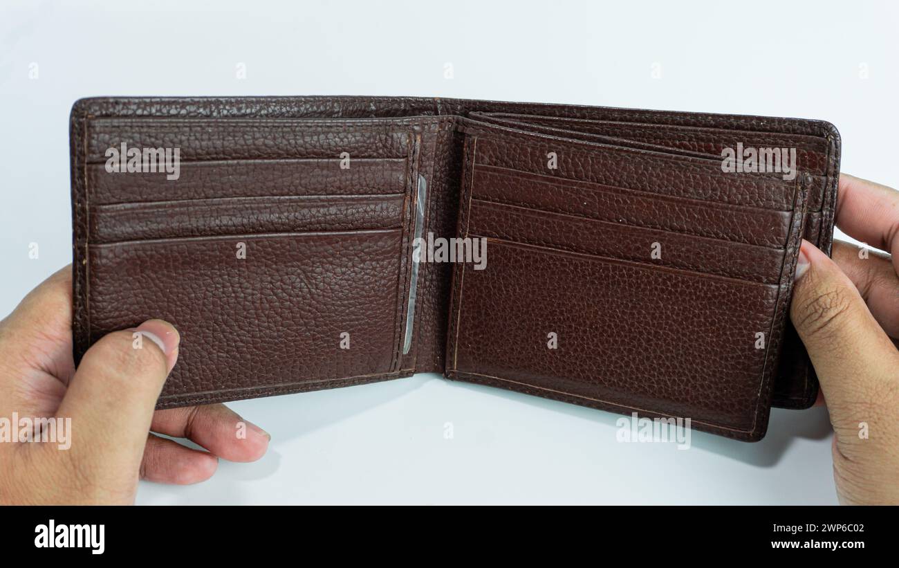 Wallet opened by hand isolated on white background Stock Photo - Alamy
