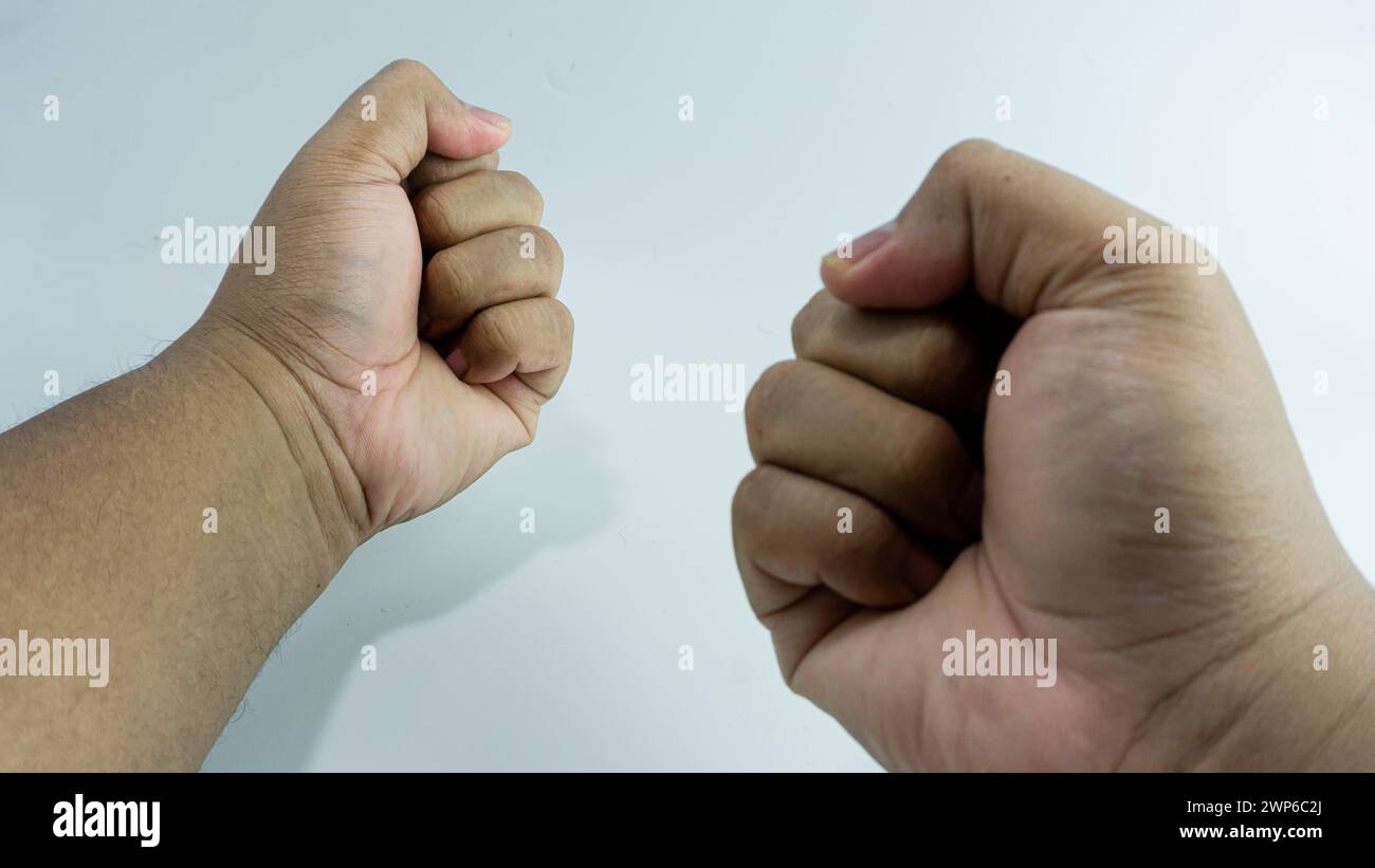 Two-handed pose of clenched fists in alert isolated on white background ...