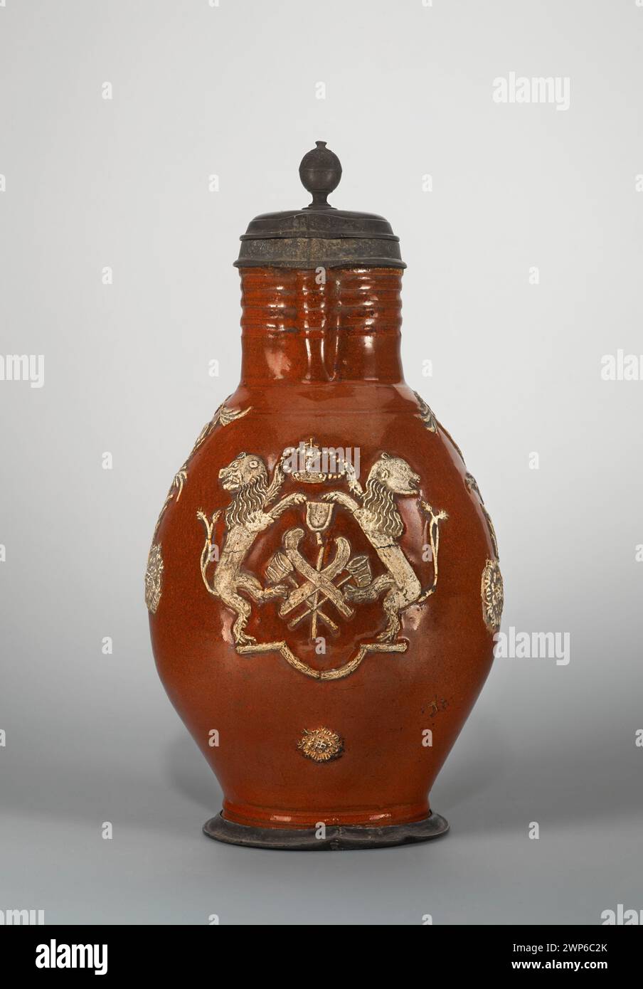 Zinc pitcher cover from Bolesławiec, decorated with guild emblems of ...