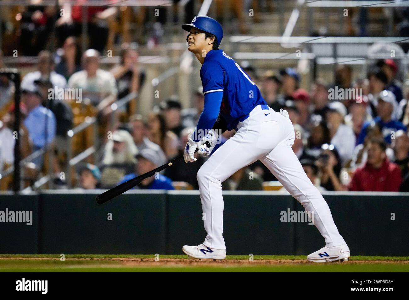 Los Angeles Dodgers designated hitter Shohei Ohtani reacts while flying ...