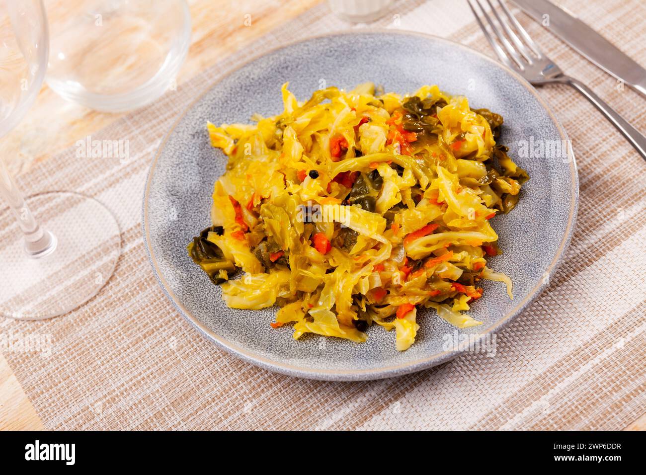 Portion of stewed cabbage on table Stock Photo - Alamy
