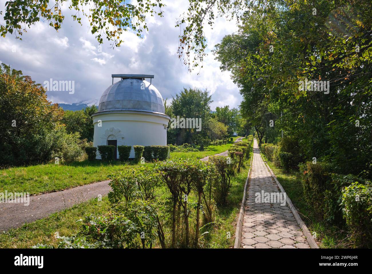 Exterior view of one of the small, white observatory buildings. At the ...