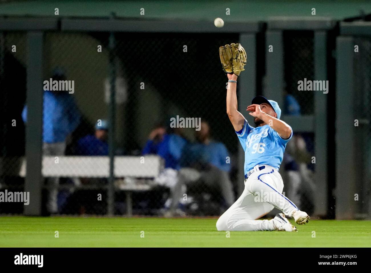 Kansas City Royals left fielder John Rave slides to make a catch on a ...