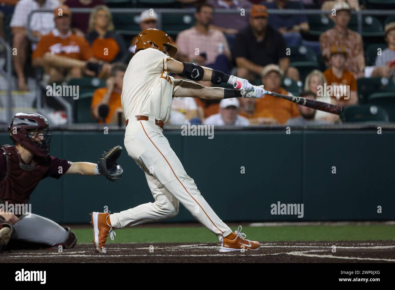 AUSTIN, TX - MARCH 05: Texas infielder Jared Thomas (9) extends his bat ...