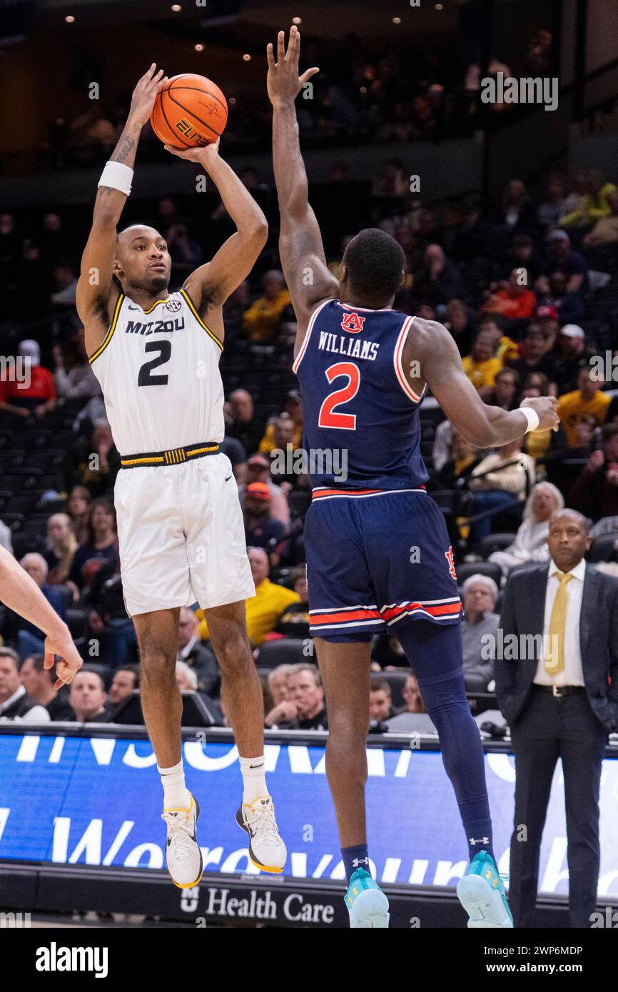 Missouri's Tamar Bates, left, shoots over Auburn's Jaylin Williams ...