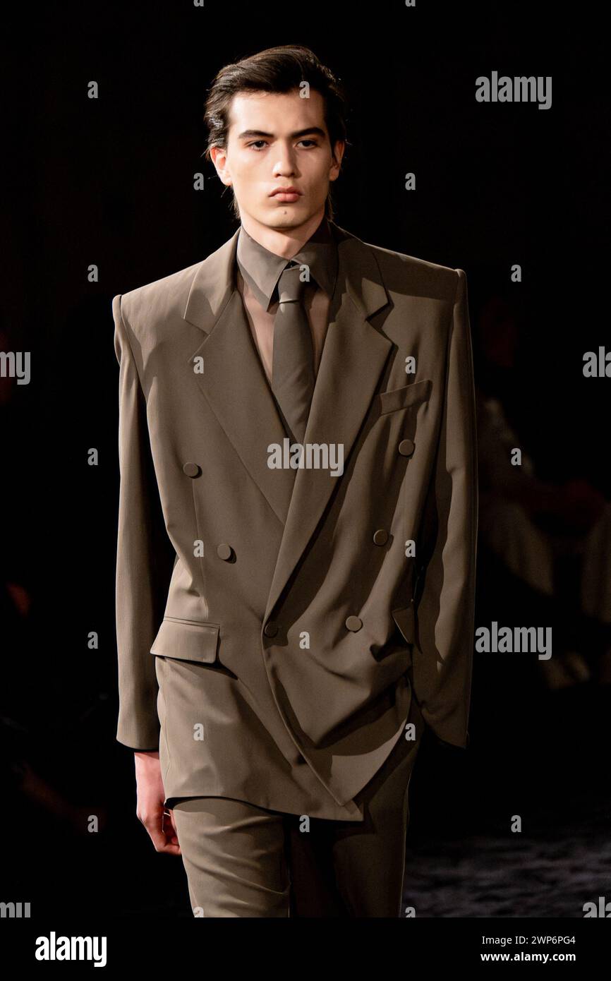 A model walks the runway during the Saint Laurent Men Collection Fall ...