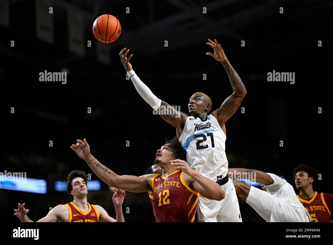 Central Florida forward C.J. Walker (21) and Iowa State forward Robert ...